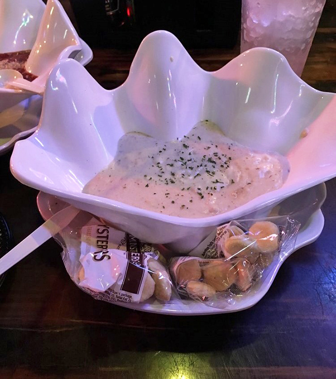 Clam chowder so creamy it should come with a warning label. Served in a shell-shaped bowl because presentation matters, folks!