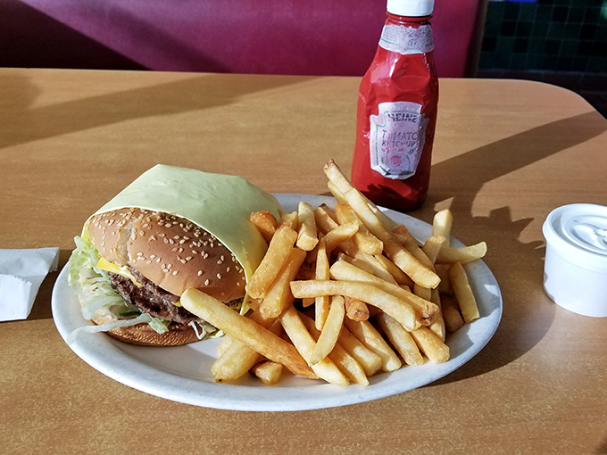 Sometimes perfection is simple: a classic cheeseburger with golden fries that reminds you why this combination conquered the world in the first place.