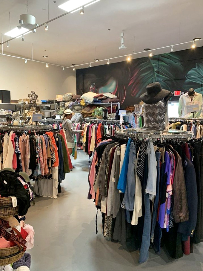 The clothing section offers a rainbow of possibilities, with a mural backdrop that adds artistic flair to your shopping adventure.