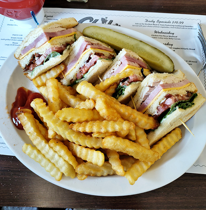 This club sandwich isn't trying to reinvent the wheel, just perfect it. Stacked high with layers that would make a geological survey team excited.