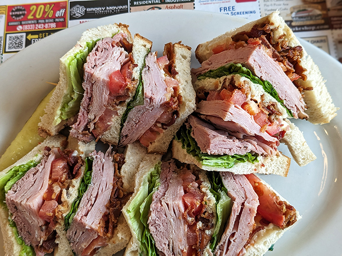 This club sandwich isn't just stacked&mdash;it's architectural. Layers of fresh turkey, crisp bacon, and garden vegetables create the skyscraper of sandwiches your lunch hour deserves. 