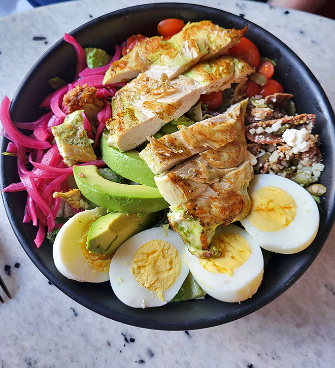 Not your average earthbound salad&mdash;grilled chicken, avocado, pickled onions, and hard-boiled eggs orbit fresh greens in perfect nutritional harmony.