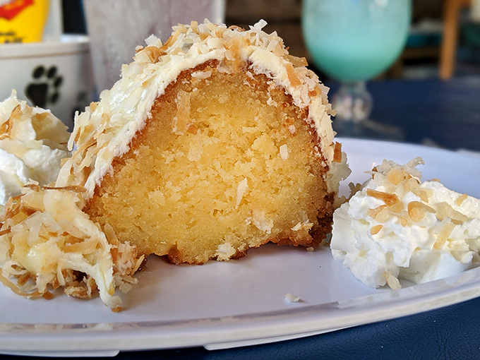 Coconut rum cake that would make pirates abandon their quests&mdash;moist, decadent, and topped with toasted coconut flakes that crunch with tropical abandon.