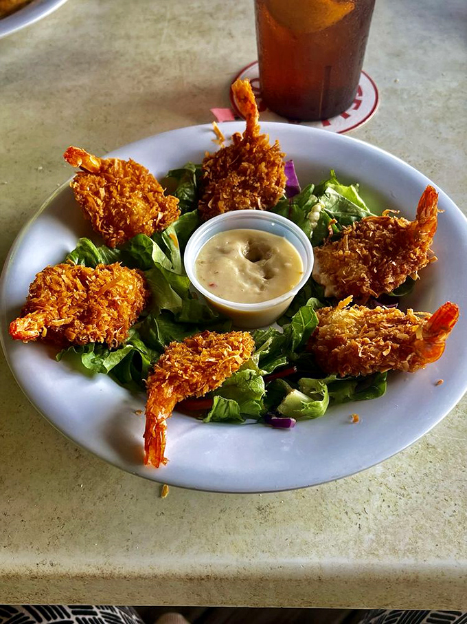 Coconut shrimp that could make a pescatarian out of anyone. Crispy, golden treasures from the sea arranged like a delicious crown around that dipping sauce.