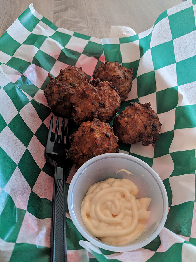 These conch fritters aren't just fried—they're little golden orbs of the Caribbean, crispy outside, tender inside, with a sauce worth bottling.