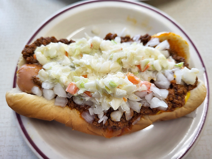 This isn't just a hot dog with toppings &ndash; it's a carefully constructed flavor bomb where each bite delivers the perfect ratio of meat, sauce, and crunch.