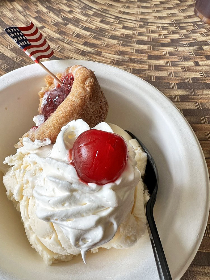 A scoop of vanilla crowned with whipped cream and a cherry, served with a side of Americana. Norman Rockwell couldn't have painted it better. 