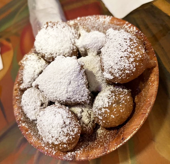 These powdered sugar-dusted fritters aren't just dessert&mdash;they're little clouds of fried happiness that make you forget you came for seafood in the first place.