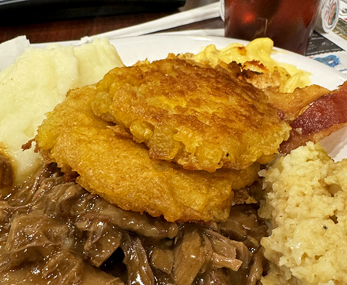 Golden-fried perfection meets savory gravy in a plate that whispers, "Diet? What diet?" Your cardiologist just felt a disturbance in the force.