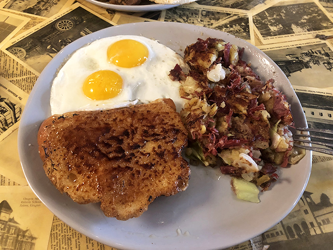 The holy trinity of breakfast: perfectly cooked eggs, crispy hash, and something fried. A plate that says "good morning" with authority.
