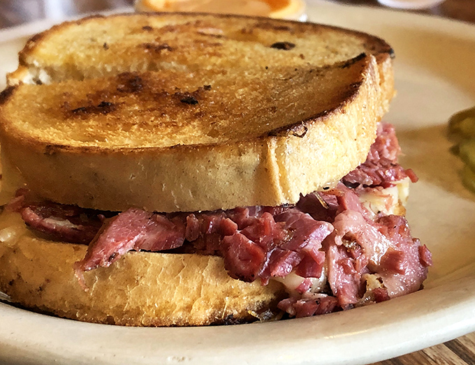 This isn't just a sandwich &ndash; it's a monument to corned beef artistry, where toasted rye cradles meat with reverent precision.