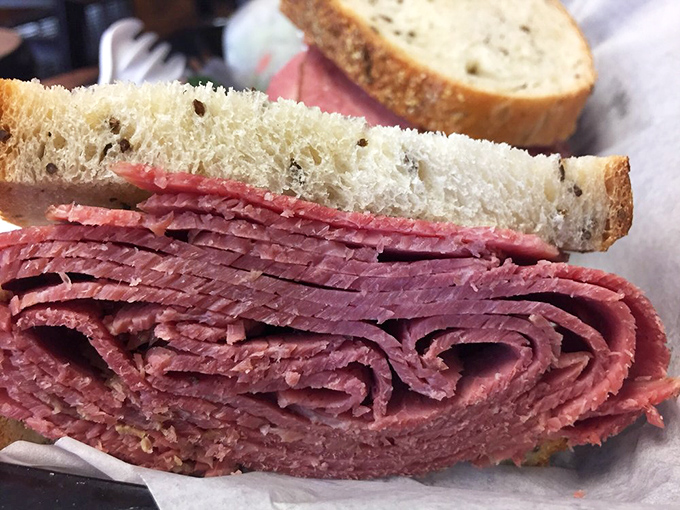 Behold the architectural marvel that is properly stacked corned beef. This isn't a sandwich; it's a skyscraper of deliciousness between bread.