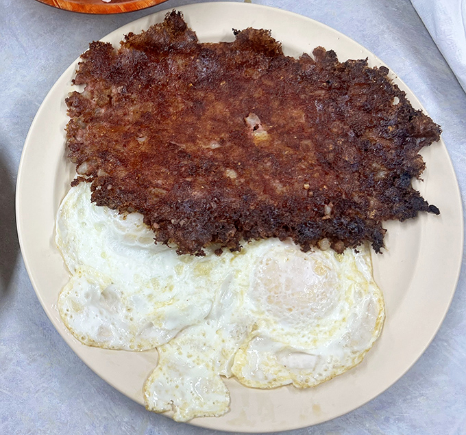 Corned beef hash so crispy it sounds like applause, paired with eggs that know exactly how to behave.