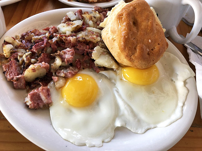Corned beef hash with sunny-side-up eggs and a biscuit that could make your grandmother question her recipe. Breakfast of champions&mdash;and everyone else too.
