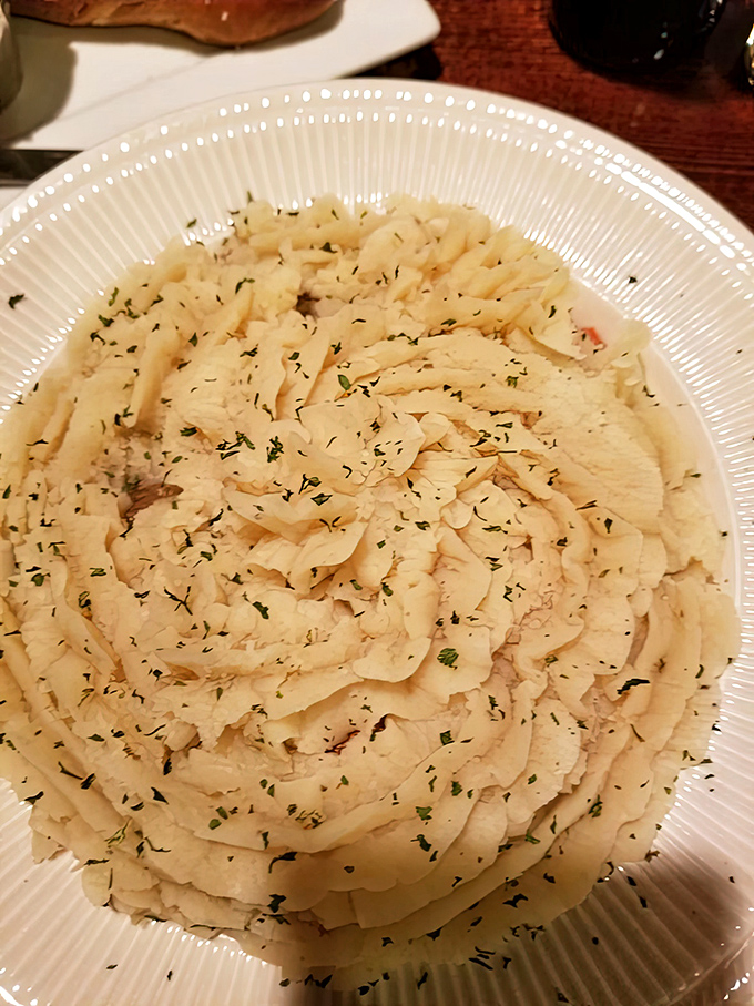 Cottage pie that looks like a cloud of potato heaven. Each forkful is a comforting hug from a British grandmother you never knew you needed.