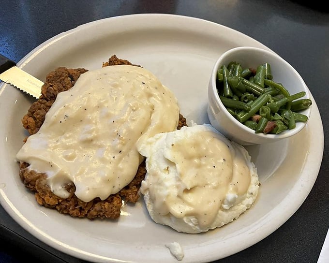Country fried steak smothered in gravy with a side of green beans &ndash; proof that sometimes the most beautiful things in life aren't beautiful at all.