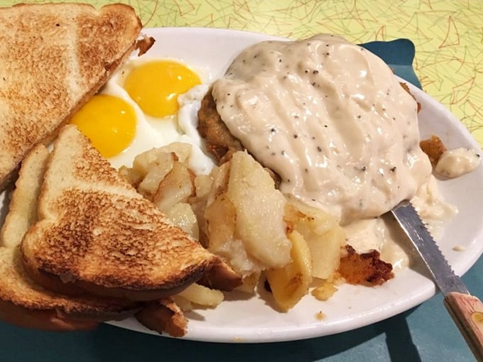 Breakfast nirvana: perfectly runny eggs, crispy home fries, and country fried steak gravy generous enough to make your cardiologist wince but your soul sing.