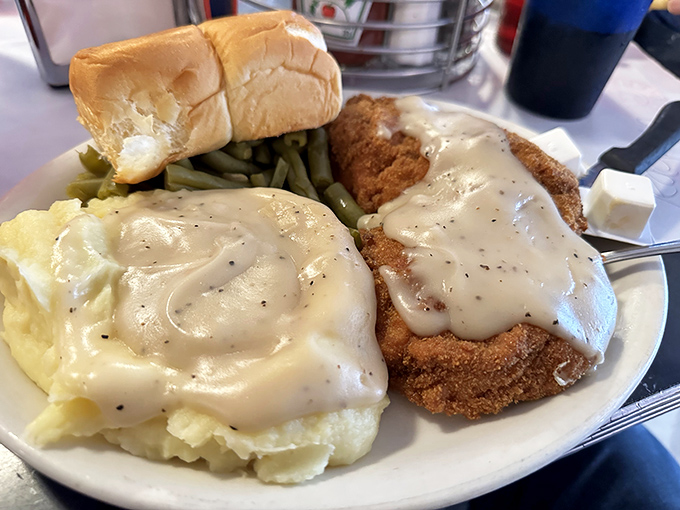 Country fried steak swimming in gravy so good you'll want to write it love letters. Comfort food that gives actual hugs.