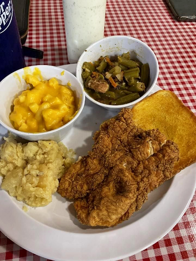 Country fried steak with sides that know their supporting role—crispy coating giving way to tender meat that's worth every calorie.