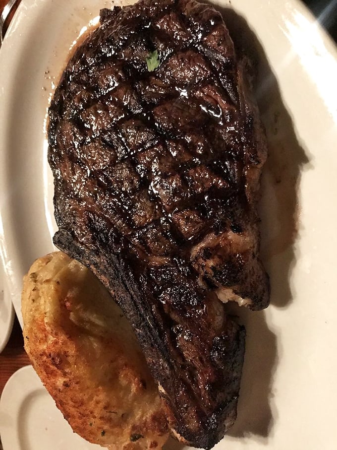 The perfect char marks on this cowboy steak aren't just for show&mdash;they're flavor geography, mapping out a journey your taste buds will never forget.