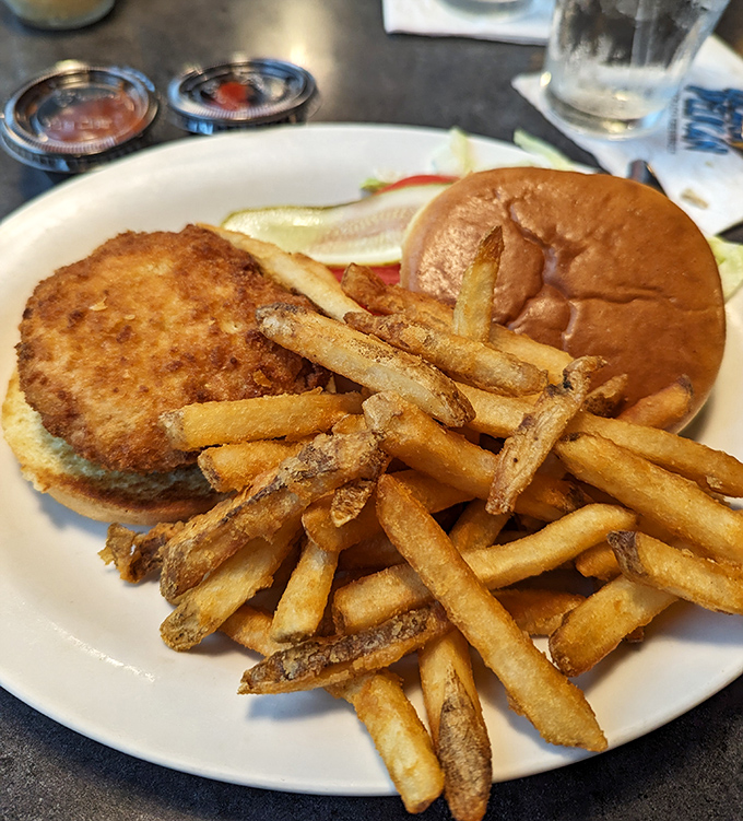 This crab cake sandwich doesn't skimp on the good stuff. Golden-brown perfection that makes french fries jealous for attention.