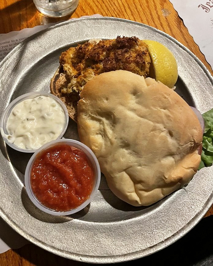 This isn't just a crab cake sandwich&mdash;it's maritime treasure on a bun. Accompanied by tangy cocktail sauce and creamy tartar, it's the ocean's finest moment.