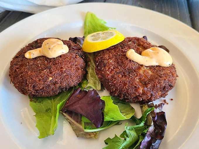 These crab cakes aren't just vacationing in Indiana—they've established permanent residence. Crispy exterior, luscious interior, and not a hint of filler regret.