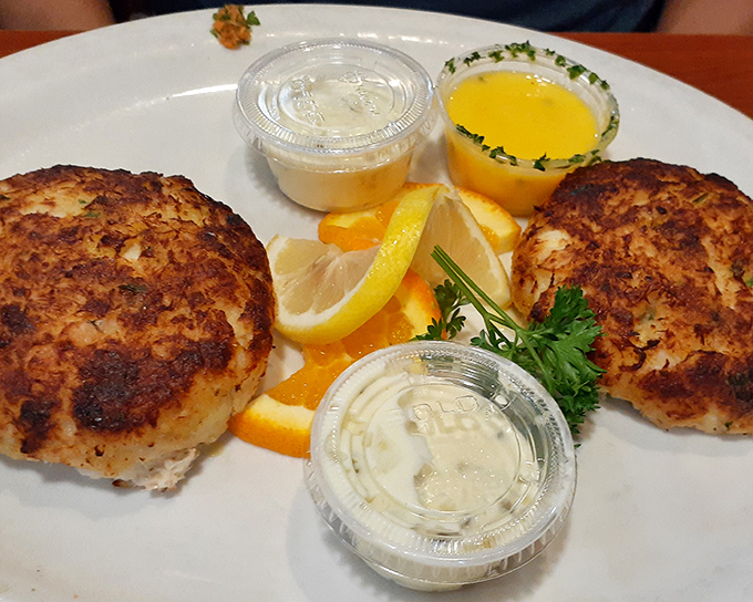 Double the crab cakes, double the joy! These twin treasures arrive perfectly bronzed, with melted butter that practically winks at you from its little dish.