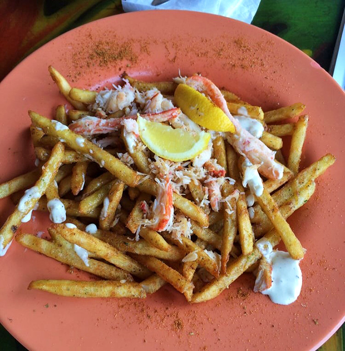 Not just fries&mdash;a seafood love affair! Crispy potatoes playing host to sweet crab meat in a romance that would make Neptune himself blush.