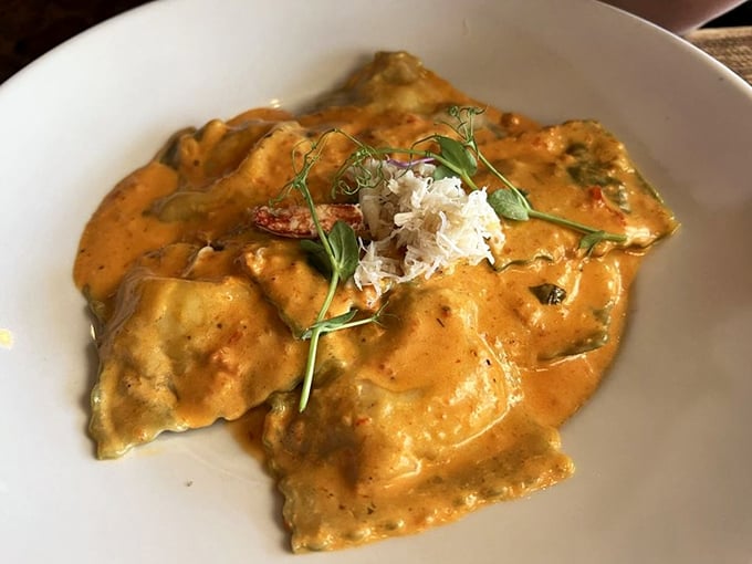 These ravioli aren't just stuffed, they're dressed for the seafood prom&mdash;crowned with crabmeat and bathed in a sauce that demands bread for sopping.