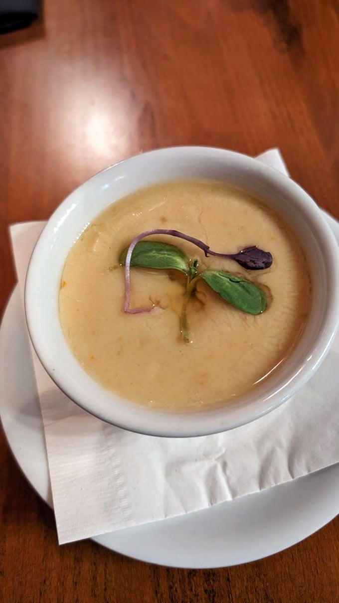 She-crab soup garnished with micro-greens is Southern elegance in a bowl. Like velvet on your tongue with a gentle seafood whisper. 