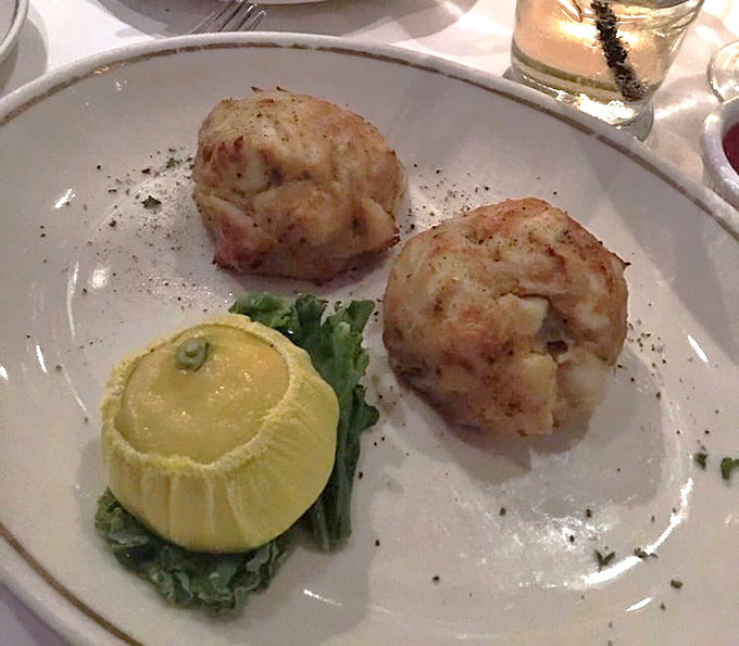 These aren't just crab cakes; they're seafood sculptures&mdash;golden-brown on the outside, delicately sweet and flaky within. The lemon stands ready for its supporting role.
