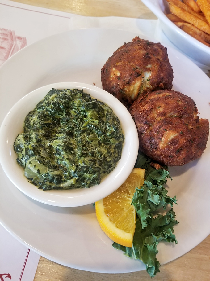 Crab cakes and creamed spinach—a Maryland power couple more beloved than Cal Ripken Jr. and his consecutive game streak.