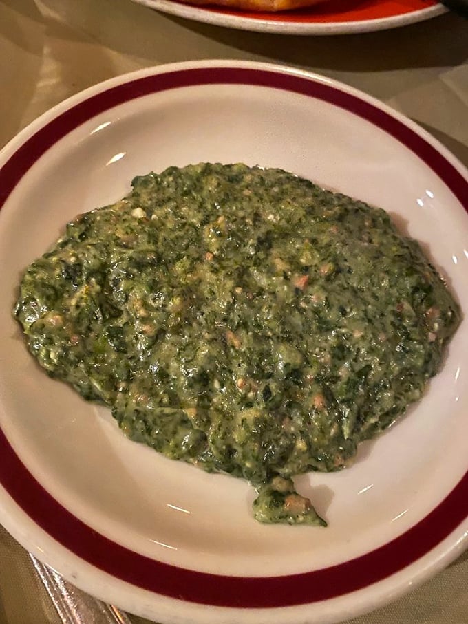 This isn't just creamed spinach; it's the vegetable that convinced a generation of meat-eaters that green things could actually taste magnificent.