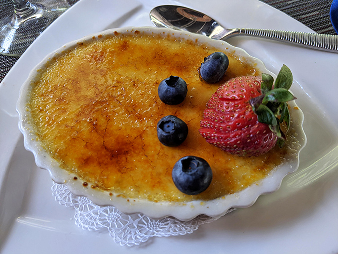 Cr&egrave;me br&ucirc;l&eacute;e with that perfect crack-worthy sugar crust and fresh berries&mdash;dessert architecture that deserves both your respect and your spoon.