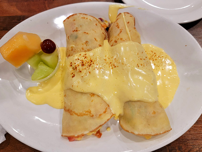 These crepes have gone to finishing school. Delicate, sophisticated, and draped in hollandaise &ndash; the breakfast equivalent of wearing pearls to the grocery store.