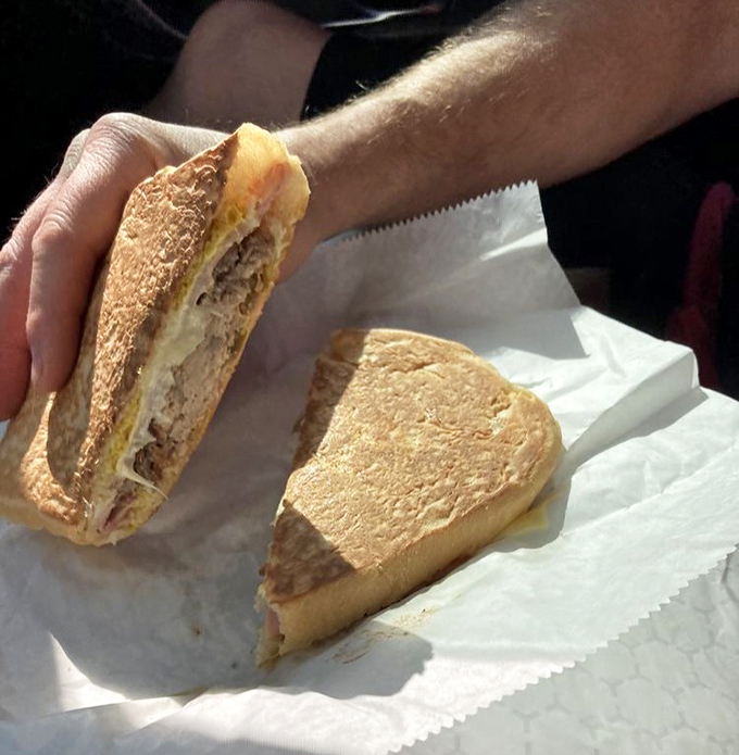 The Cuban sandwich here achieves that perfect harmony of crispy exterior and melty interior. Architecture and engineering in edible form.