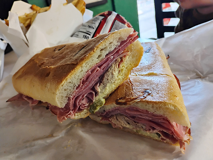 Behold the Cuban sandwich in its natural habitat&mdash;pressed to perfection with layers of meat and cheese playing together like a well-rehearsed symphony.
