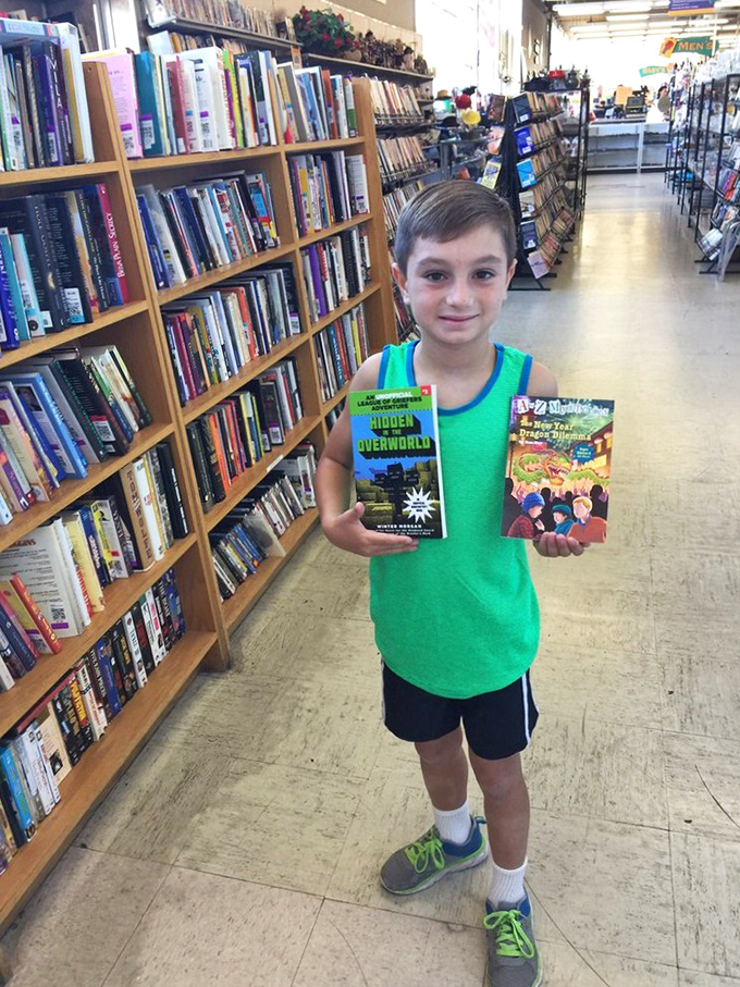 Young bibliophile strikes gold in the book section, proving great stories never go out of style. 