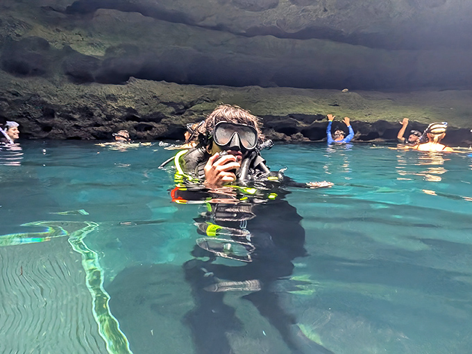 "Just checking my underwater email!" Divers explore the crystal-clear waters where prehistoric creatures once roamed.