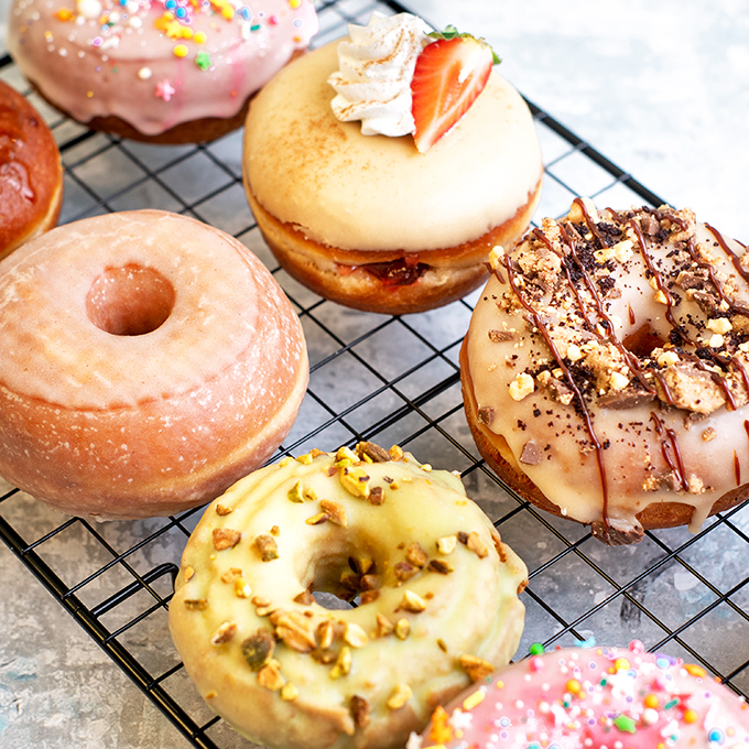 Donut decision paralysis is real&mdash;glazed, sprinkled, or topped with nuts, each ring of joy promises a moment of sweet escape from everyday worries.