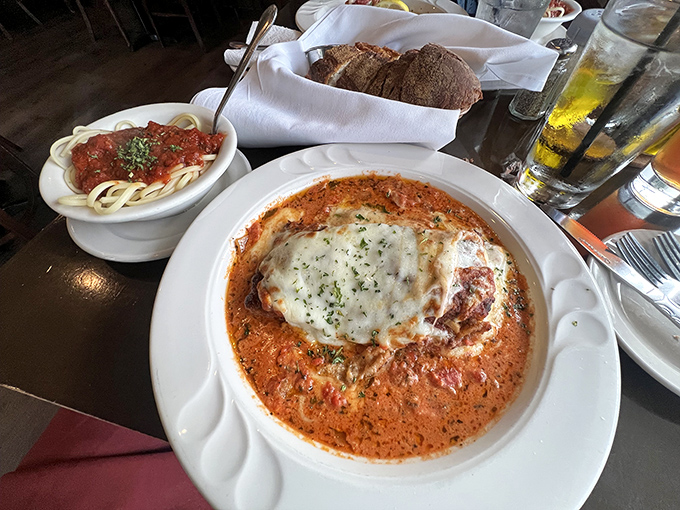 Not just dinner, but a warm embrace—this chicken parmesan bathes in marinara with a side of perfectly sauced pasta.