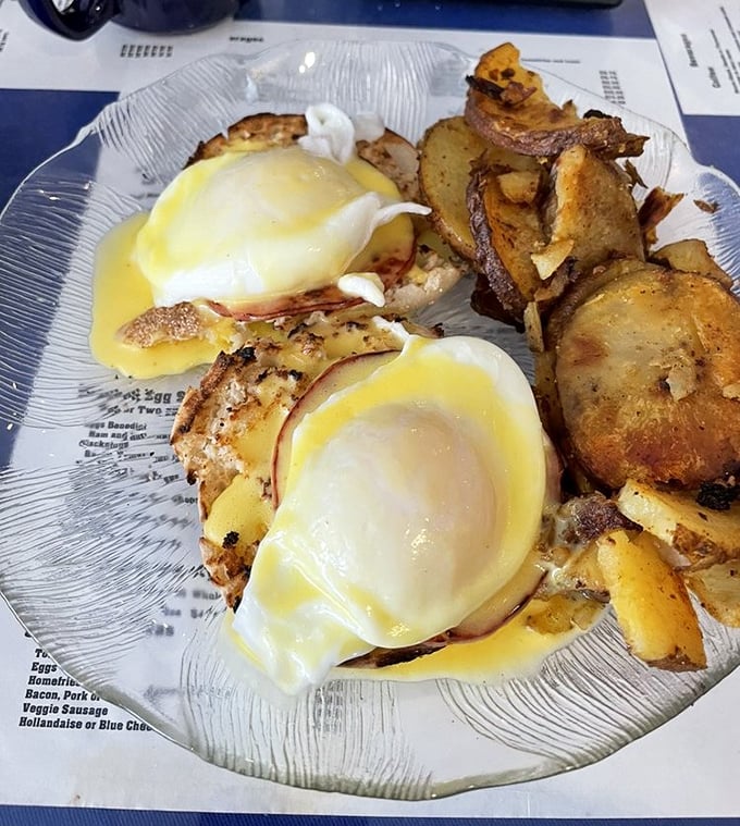 These eggs Benedict aren't just perfectly poached&mdash;they're having the time of their lives swimming in hollandaise while lounging on what appears to be Canadian bacon royalty.