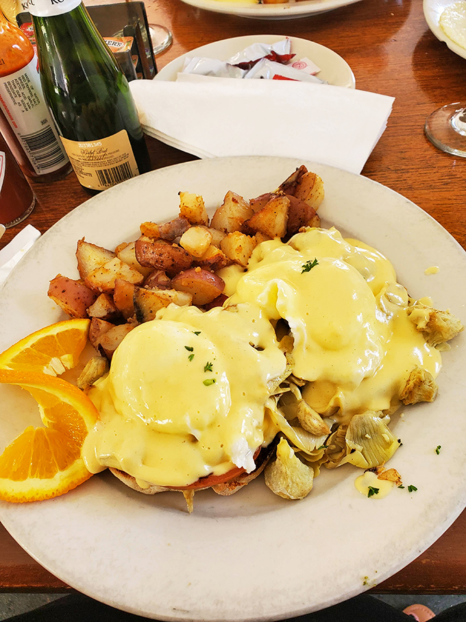 Eggs Benedict that would make a French chef tip his toque&mdash;golden hollandaise cascading over English muffins like a breakfast waterfall.