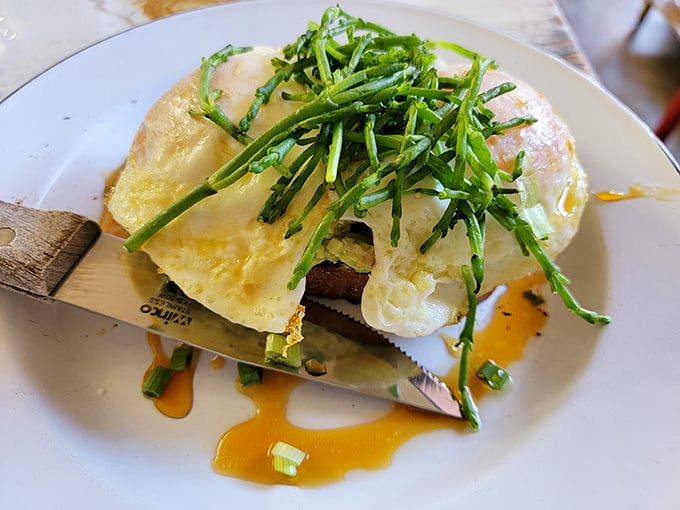 This isn't just eggs benedict&mdash;it's a morning masterpiece. Perfectly poached eggs crowned with fresh greens and hollandaise that flows like liquid sunshine.