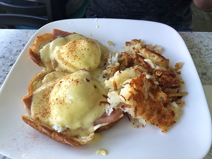 Eggs Benedict done right&mdash;poached eggs perched atop Canadian bacon with hollandaise cascading down like a yellow waterfall of happiness.