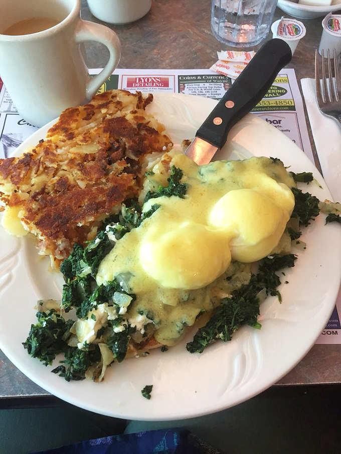 Eggs Benedict with a side of hash browns that could make a morning person out of anyone. That hollandaise sauce is liquid sunshine.