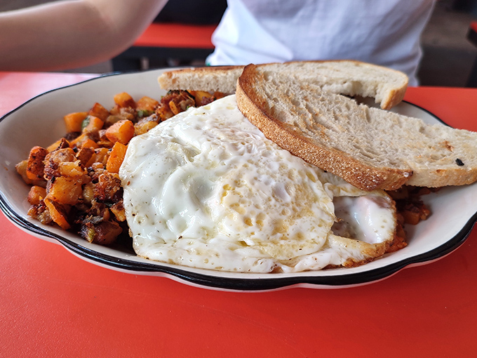 Breakfast alchemy at its finest&mdash;crispy potatoes, farm-fresh eggs, and toast that actually tastes like something. Morning salvation on a plate.