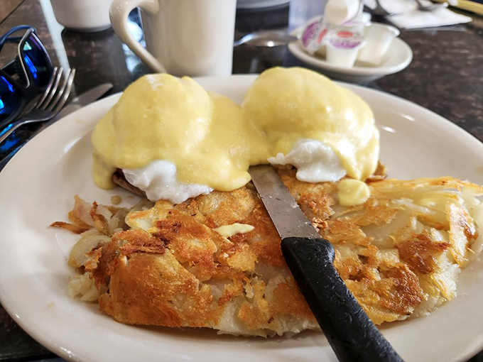 Eggs Benedict that would make the actual Benedict Arnold switch sides again. That hollandaise sauce is practically performing a ballet on those English muffins.