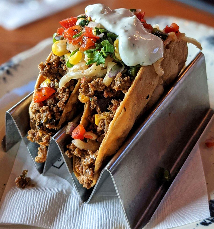 These aren't your average tacos&mdash;they're architectural marvels of seasoned meat, fresh vegetables, and melty cheese, perfectly engineered for maximum flavor delivery.